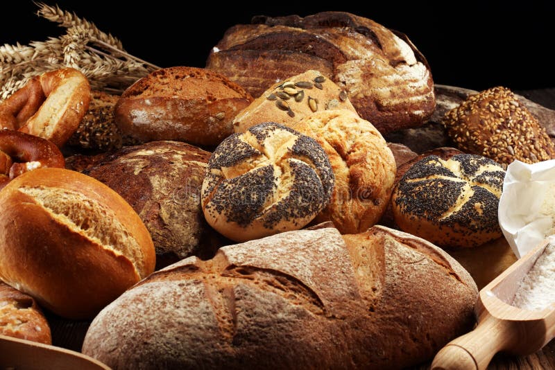 Different Kinds of Bread and Bread Rolls on Board from Above. Kitchen ...