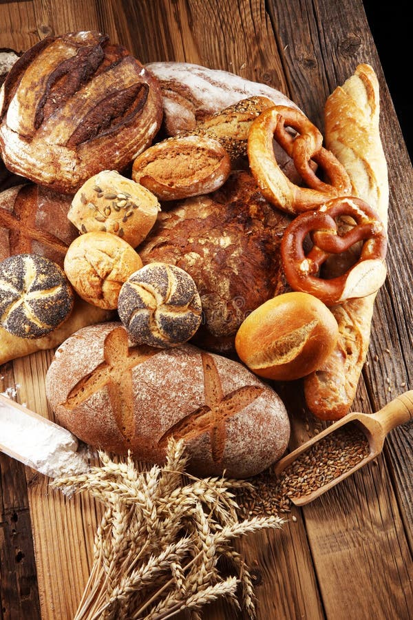 Different Kinds of Bread and Bread Rolls on Board from Above. Kitchen ...