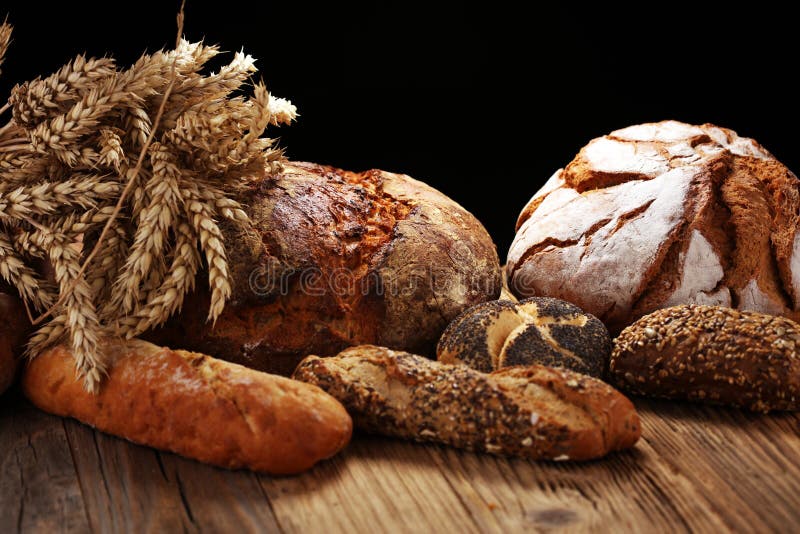 Different Kinds of Bread and Bread Rolls on Board from Above. Kitchen ...