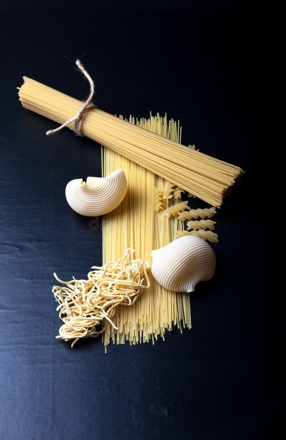 Different Kinds of Pasta on a Black Background Stock Photo - Image of ...