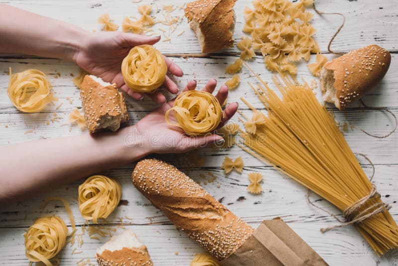 Different Kinds of Pasta on Wooden Table, Bread Stock Image - Image of ...