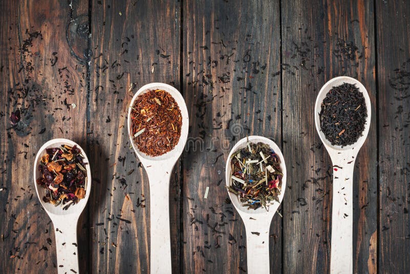 Different Kinds of Tea in Wooden Spoons on Wood Table Stock Image ...