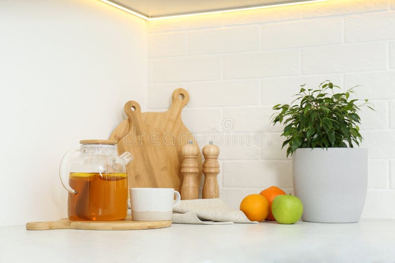 Different Kitchen Items and Houseplant on Countertop Stock Photo ...