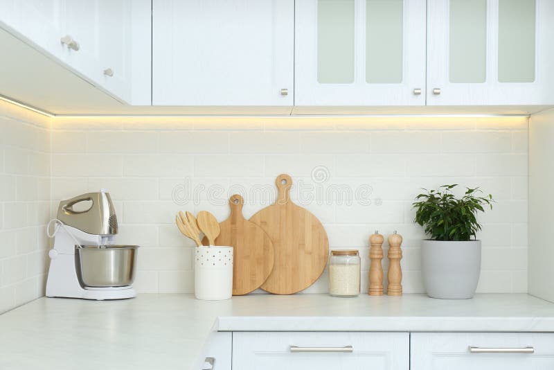 Different Kitchen Items and Houseplant on Countertop Stock Photo ...