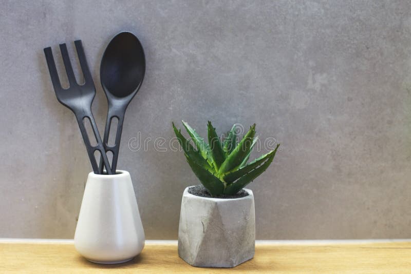 Different Kitchen Tools for Cooking on the Gray Concrete Wall ...
