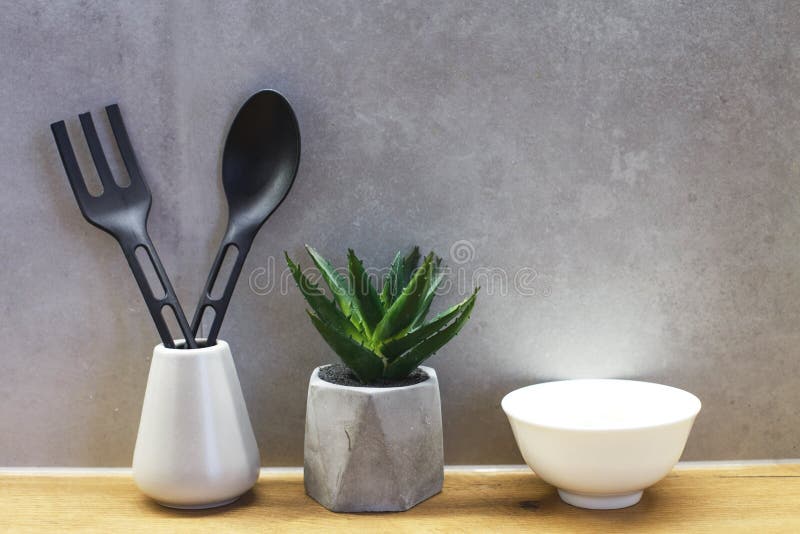 Different Kitchen Tools for Cooking on the Gray Concrete Wall ...