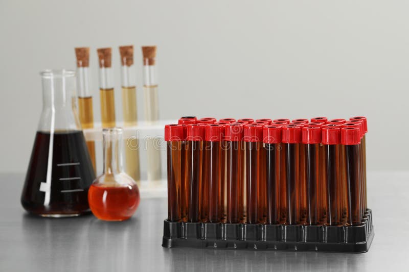 Different Laboratory Glassware with Brown Liquids on Table Against ...