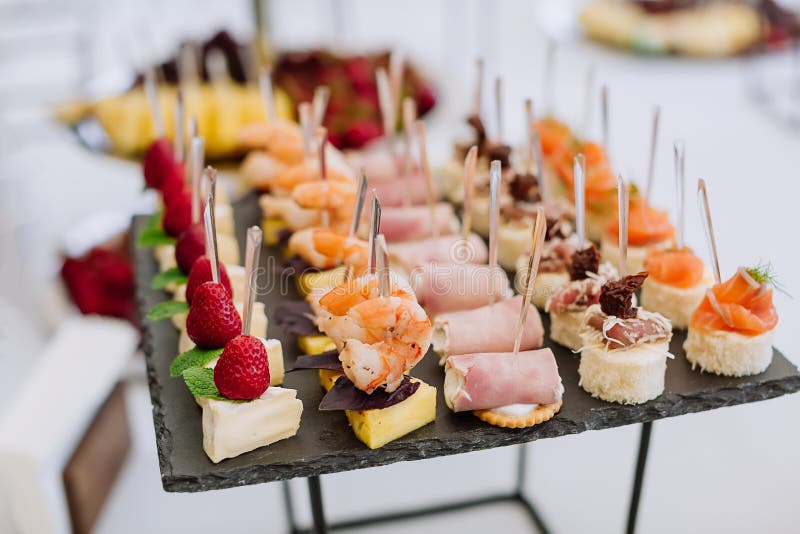 Different Light Snack on Glass and Wooden Tray Stock Photo - Image of ...