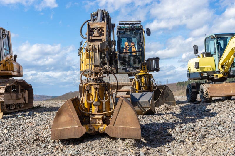 Different Machines at a Construction Site - Excavator with Shovel Stock ...
