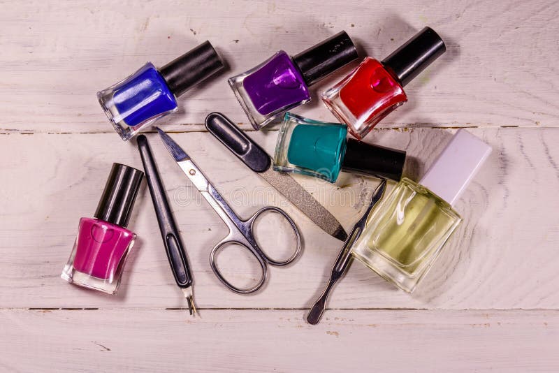Different Manicure Tools and Nail Polishes on Wooden Table. Top View ...