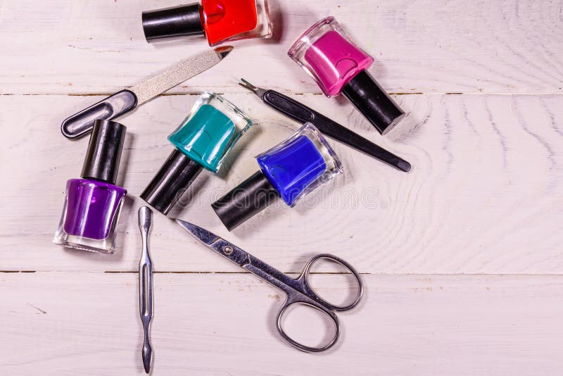 Different Manicure Tools and Nail Polishes on Wooden Table. Top View ...
