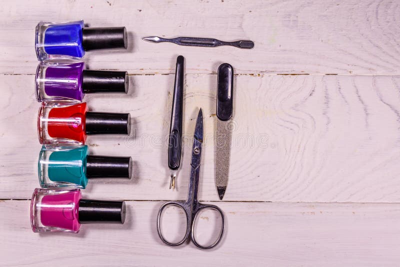 Different Manicure Tools and Nail Polishes on Wooden Table. Top View ...