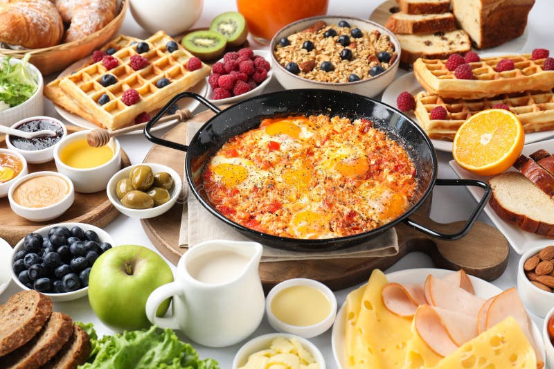 Different Meals Served for Breakfast on White Table Stock Image - Image ...