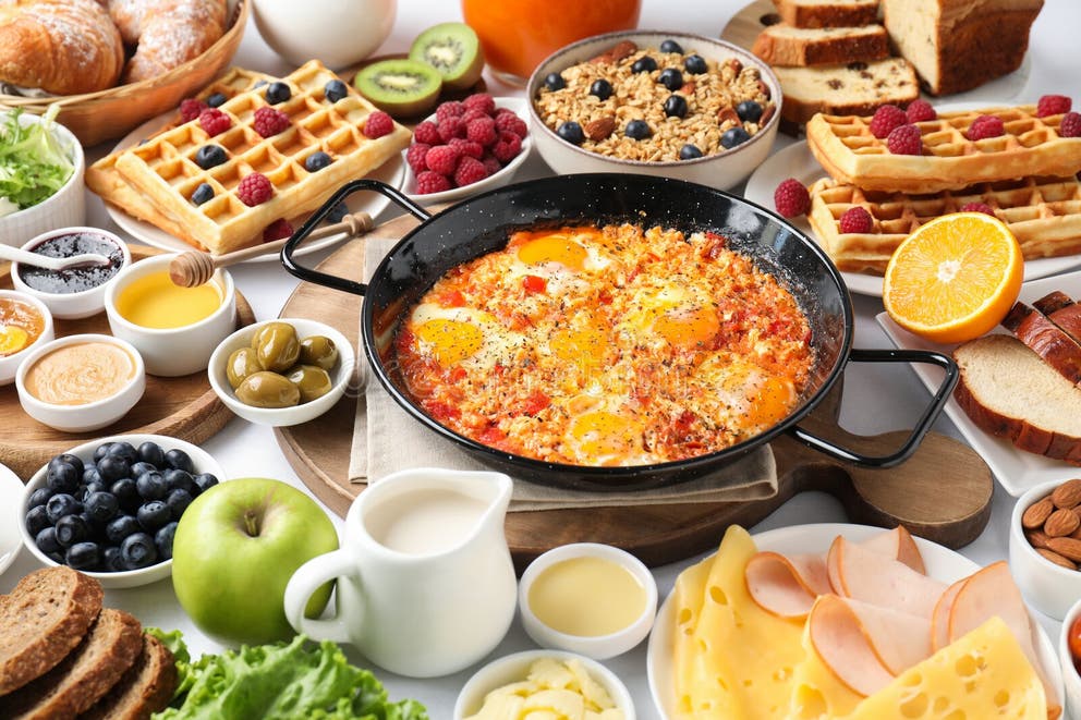 Different Meals Served for Breakfast on White Table Stock Image - Image ...