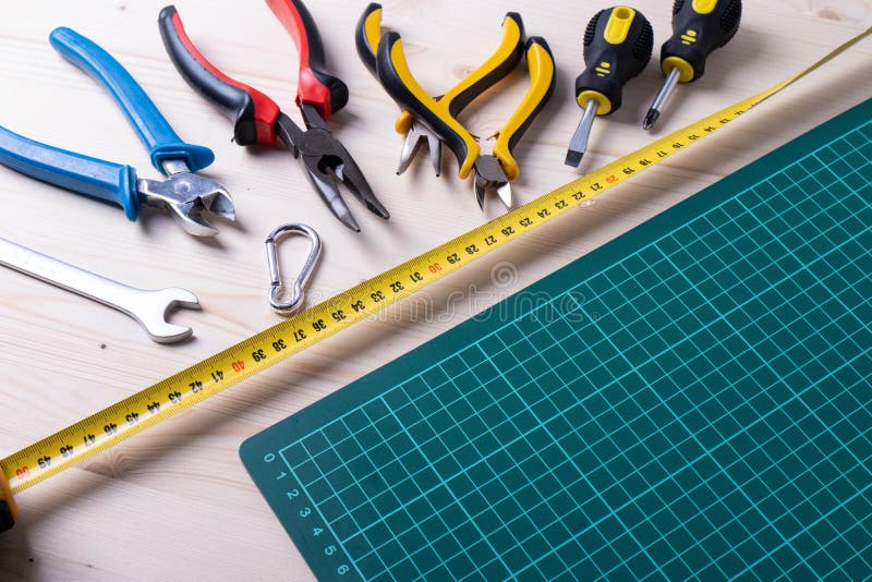 Different Mechanic or Electrician Worker Tools on the Green Checked Mat ...
