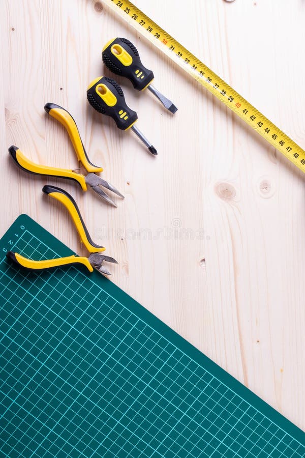 Different Mechanic or Electrician Worker Tools on the Green Checked Mat ...