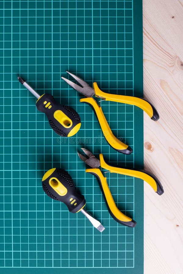 Different Mechanic or Electrician Worker Tools on the Green Checked Mat ...