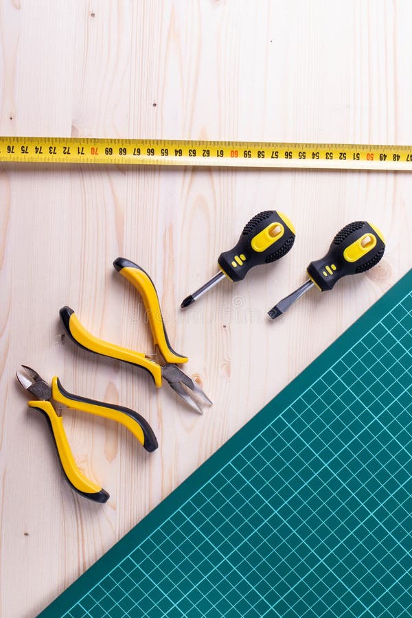 Different Mechanic or Electrician Worker Tools on the Green Checked Mat ...