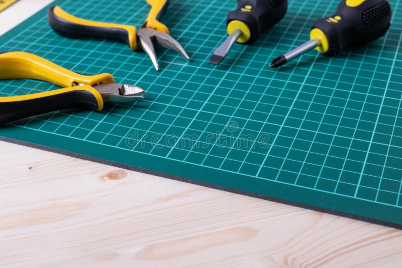 Different Mechanic or Electrician Worker Tools on the Green Checked Mat ...