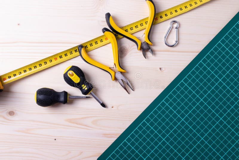 Different Mechanic or Electrician Worker Tools on the Green Checked Mat ...