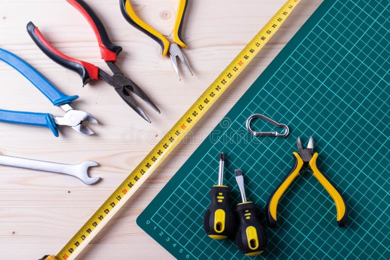 Different Mechanic or Electrician Worker Tools on the Green Checked Mat ...