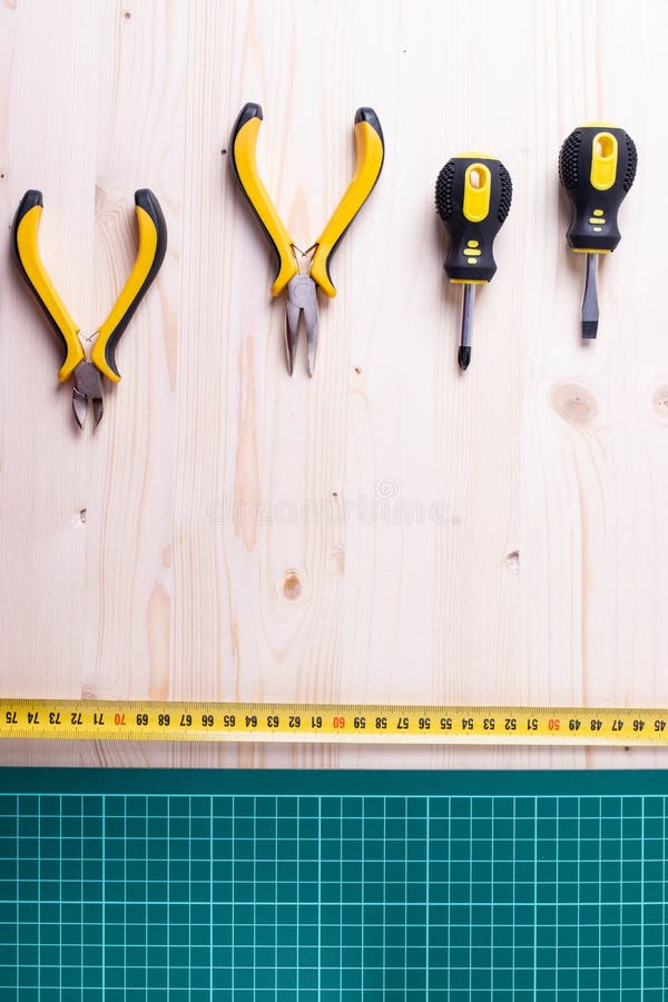 Different Mechanic or Electrician Worker Tools on the Green Checked Mat ...
