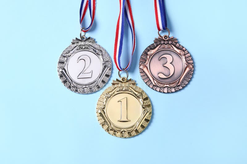 Different Medals on Light Blue Background, Flat Lay Stock Image - Image ...