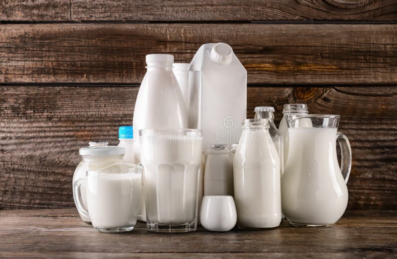 Different Milk Products on Wooden Table Stock Photo - Image of ...