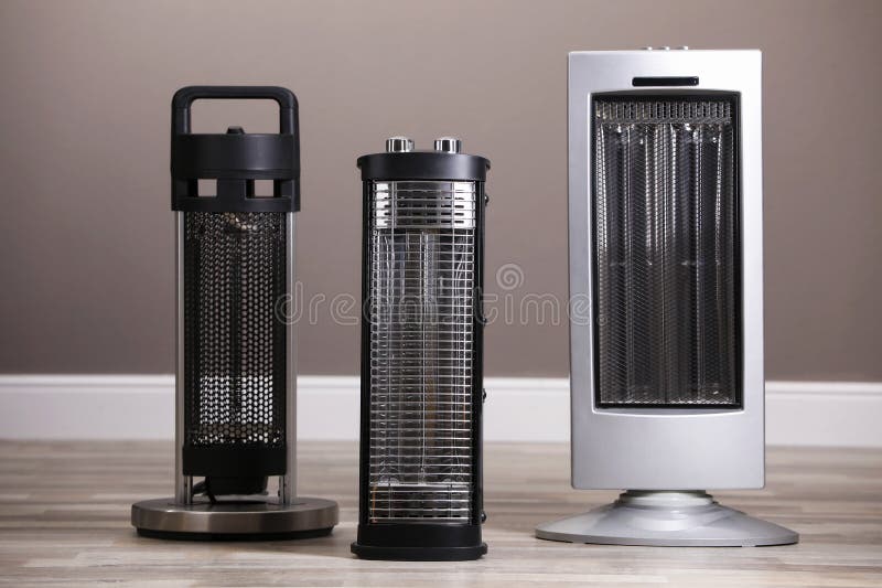 Different Modern Infrared Heaters on Floor Indoors Stock Image - Image ...
