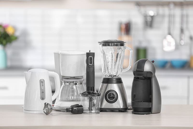 Different Modern Kitchen Appliances on Table Indoors. Stock Photo ...