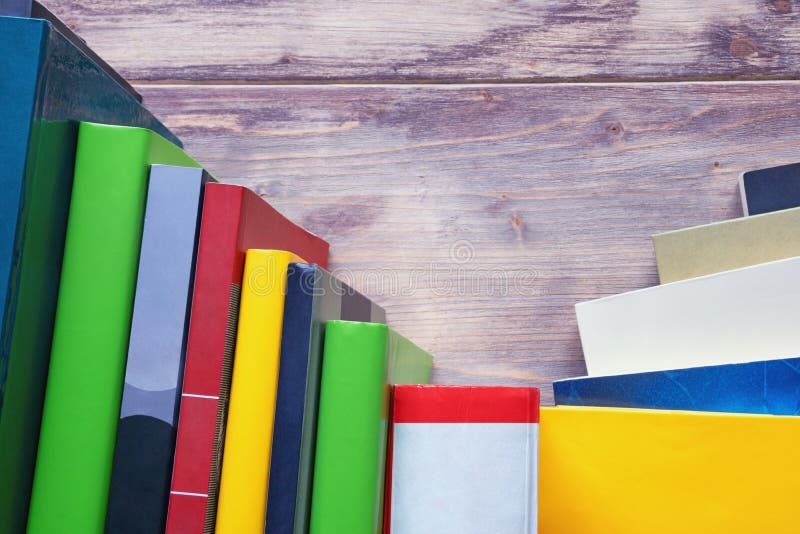 Different Multi-colored Books on Rustic Table. Copy Space Stock Photo ...