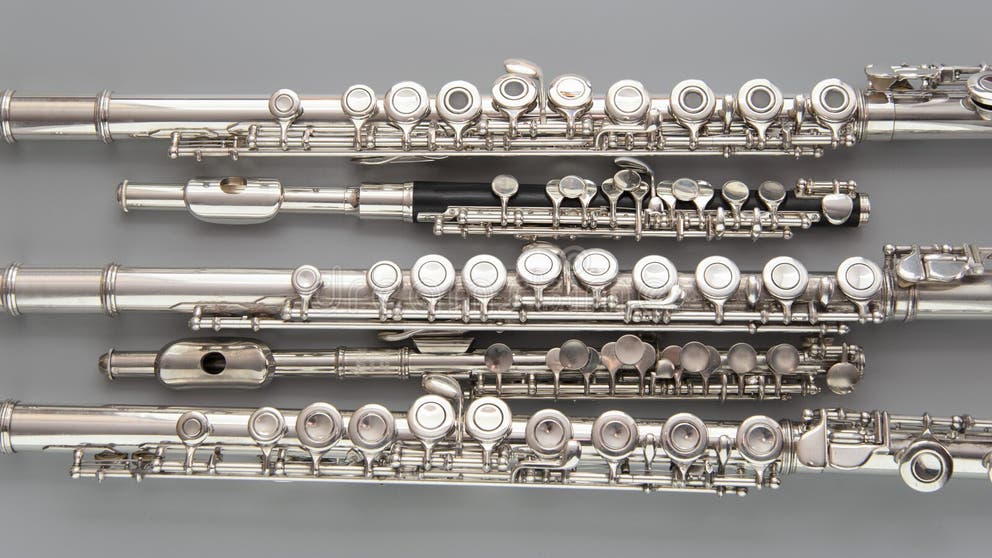 Different Musical Instruments Flute Stacked on a Gray Surface Stock ...
