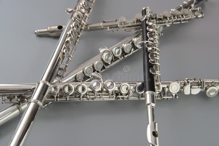 Different Musical Instruments Flute Stacked on a Gray Surface Stock ...