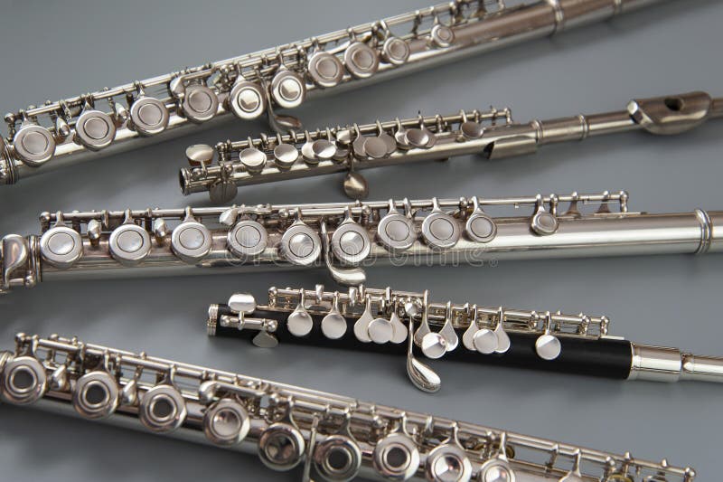 Different Musical Instruments Flute Stacked on a Gray Surface Stock ...