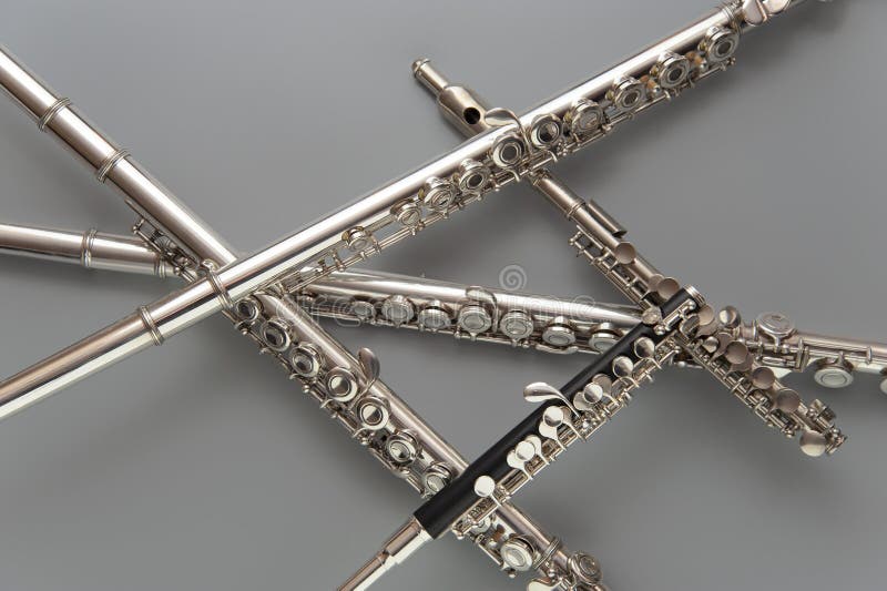 Different Musical Instruments Flute Stacked on a Gray Surface Stock ...