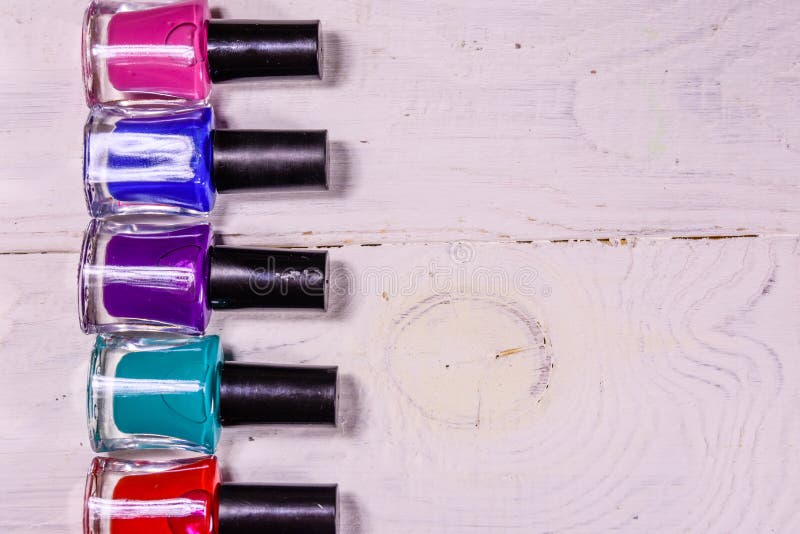 Different Nail Polishes on a Wooden Table. Top View Stock Photo - Image ...
