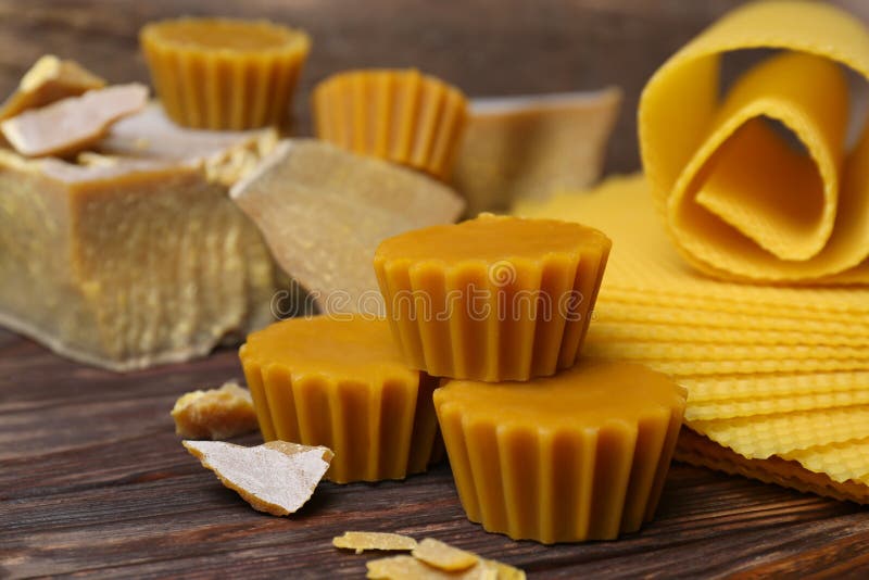 Different Natural Beeswax Blocks and Sheets on Wooden Table, Closeup ...