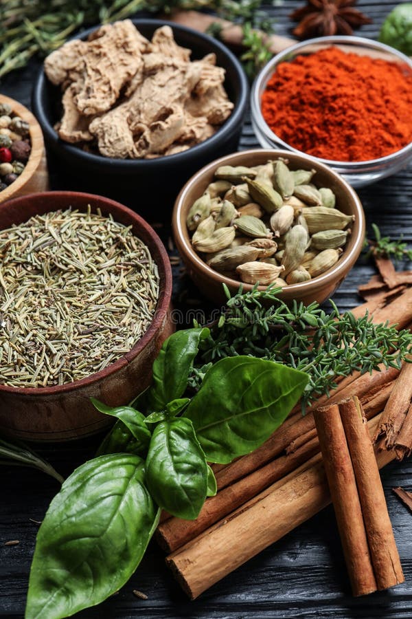 Different Natural Spices and Herbs on Wooden Table Stock Photo - Image ...