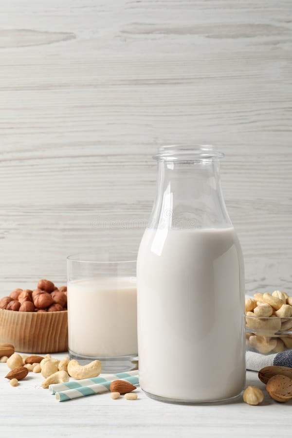 Different Nut Milks on Light Grey Marble Table Stock Photo - Image of ...