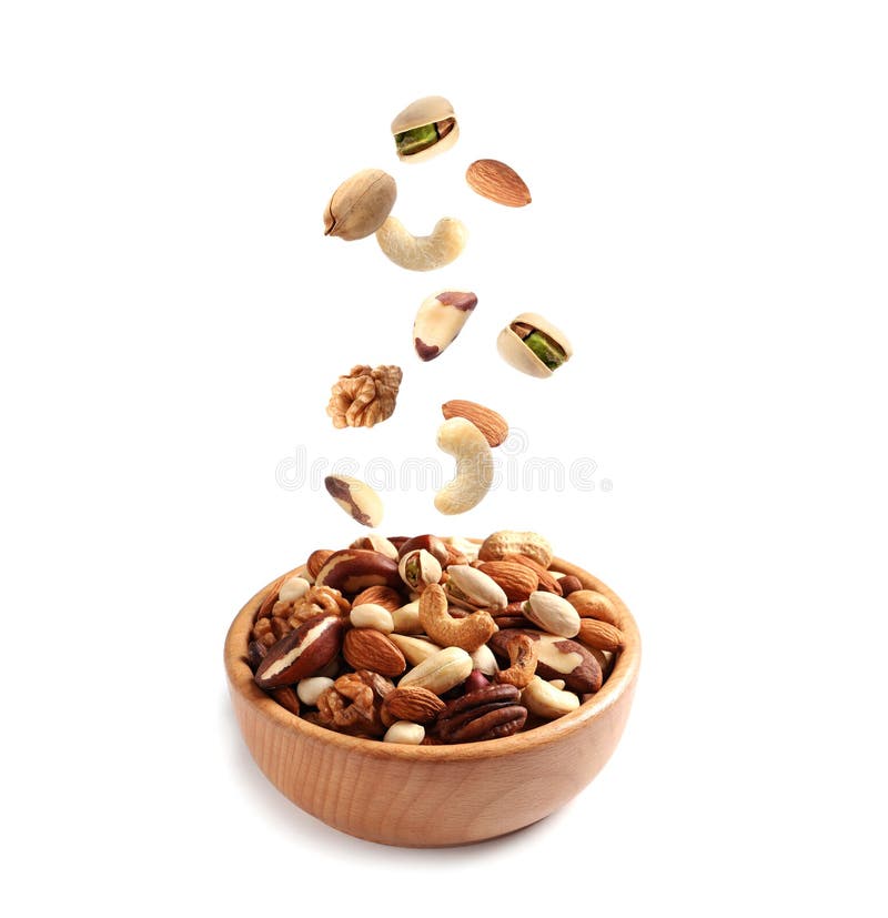 Different Nuts Falling into Pile on Background Stock Photo - Image of ...