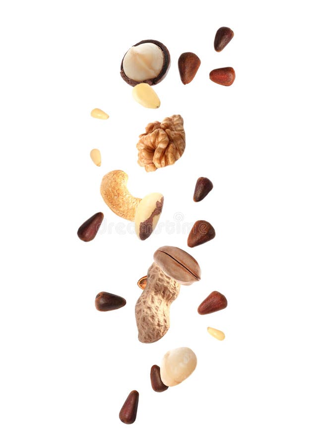 Different Nuts Falling into Pile on Background Stock Photo - Image of ...