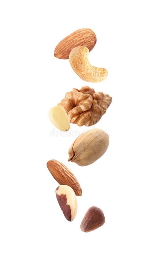 Different Nuts Falling into Pile on Background Stock Photo - Image of ...