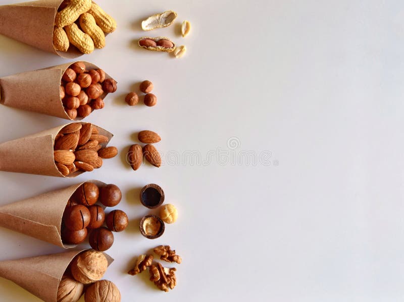 Different Nuts Source of Protein on a Light Background Close-up. the ...
