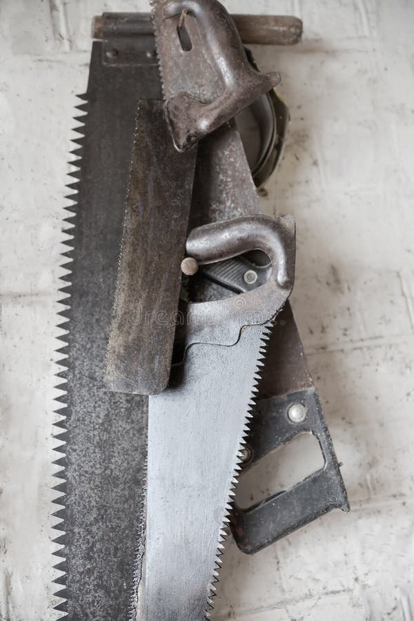 Different Old Crosscut Saws Hanging on the White Wall Stock Image ...