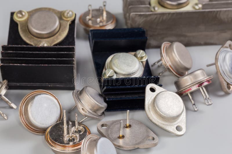Different Old Power Transistors in Metal Packages on Gray Surface Stock ...