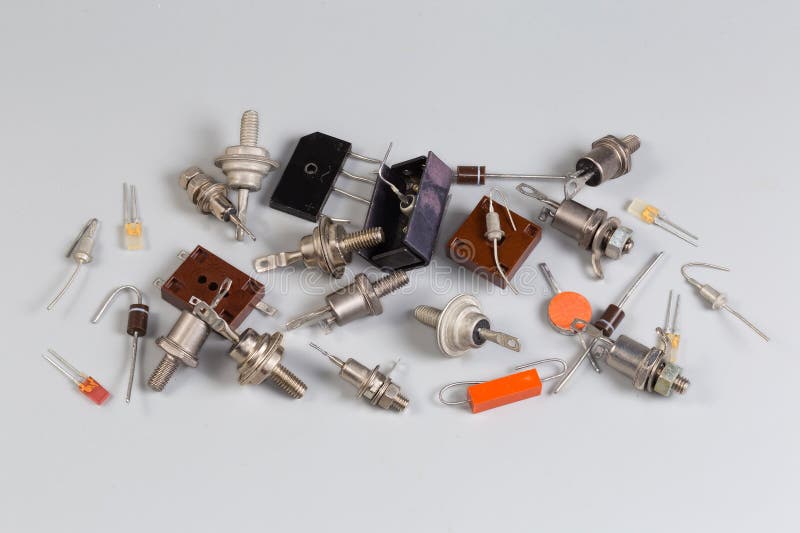 Different Old Semiconductor Diodes in Various Packages on Gray Surface ...