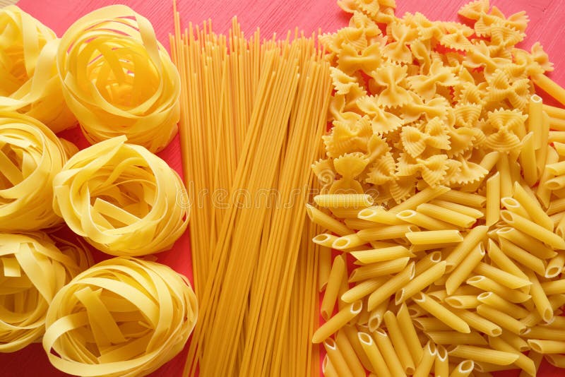 Different Pasta for Cooking on a Pink Background Stock Photo - Image of ...