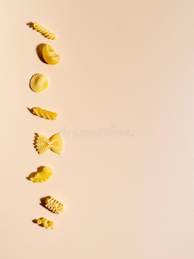 Different Pasta on Cream Background, Copy Space Stock Photo - Image of ...