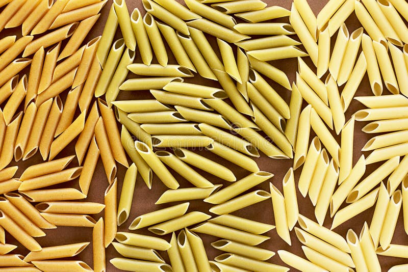 Different Pasta in the Form of Tubes of Brown, Yellow and Green Colors ...