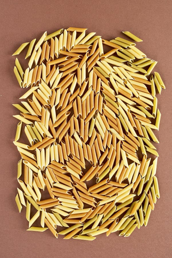 Different Pasta in the Form of Tubes of Brown, Yellow and Green Colors ...
